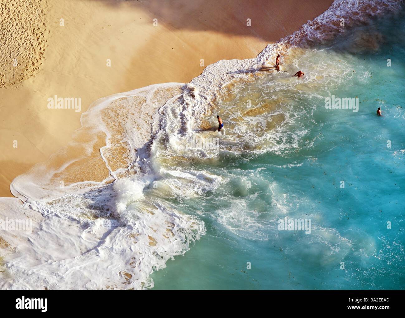 people bathing on the beach at Kelingking, Indonesia, Bali, Nusa Penida ...