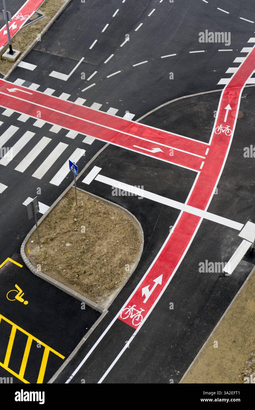 The image shows a complex intersection with designated bike lanes ...