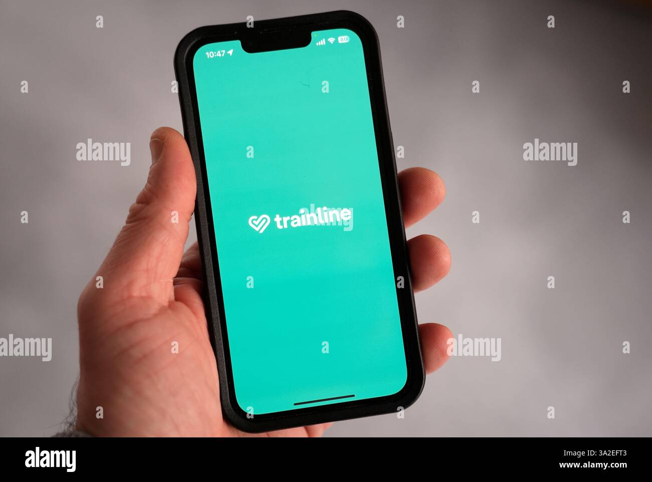 A phone showing the Trainline app. Trainline has revealed it made a ...
