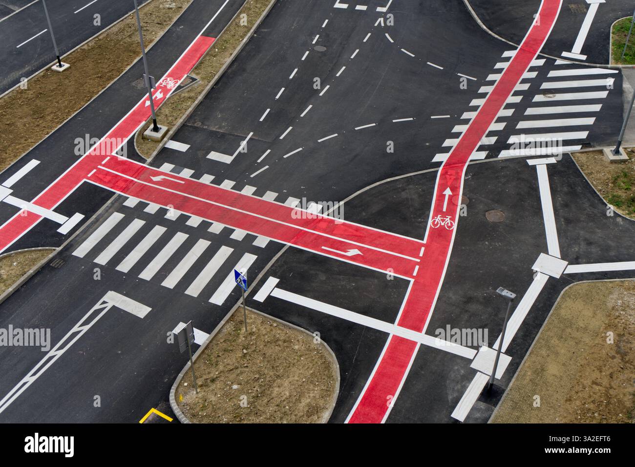 The image shows a complex intersection with designated bike lanes ...