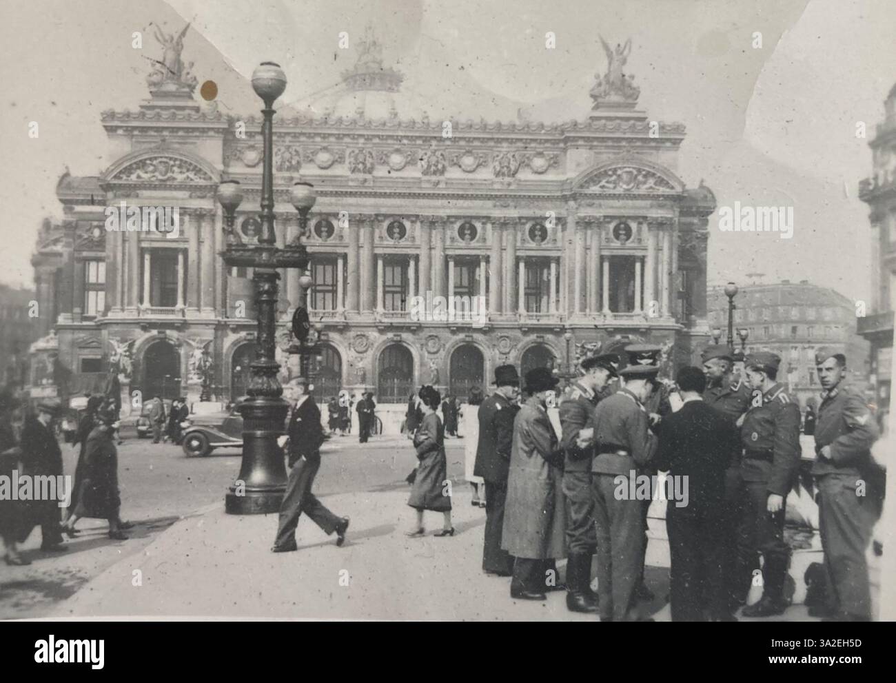 This photograph shows German soldiers stationed in front of the Opera ...