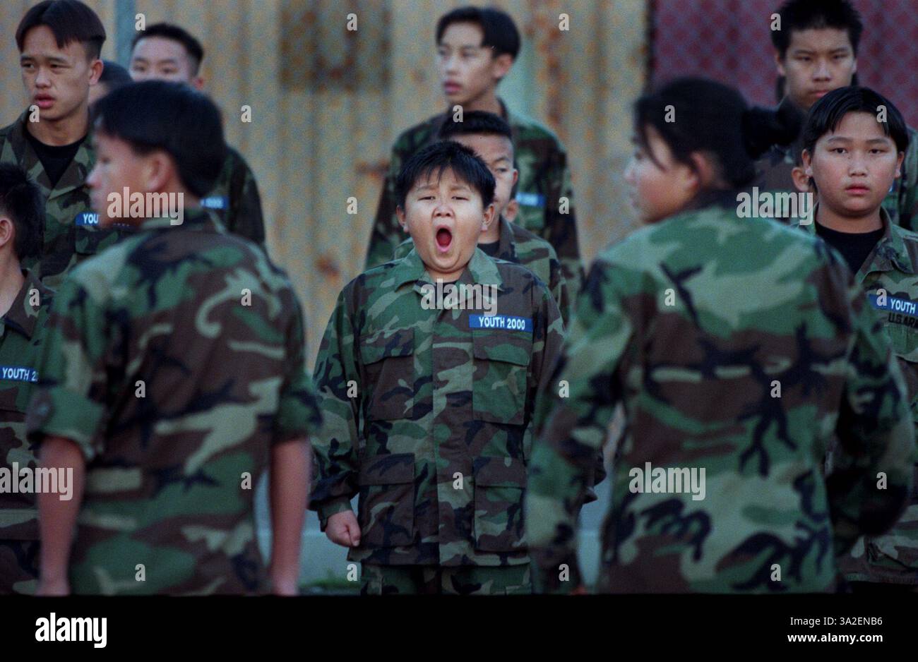Kevin Vang 10, yawns during the line-up of the cadets before the march ...