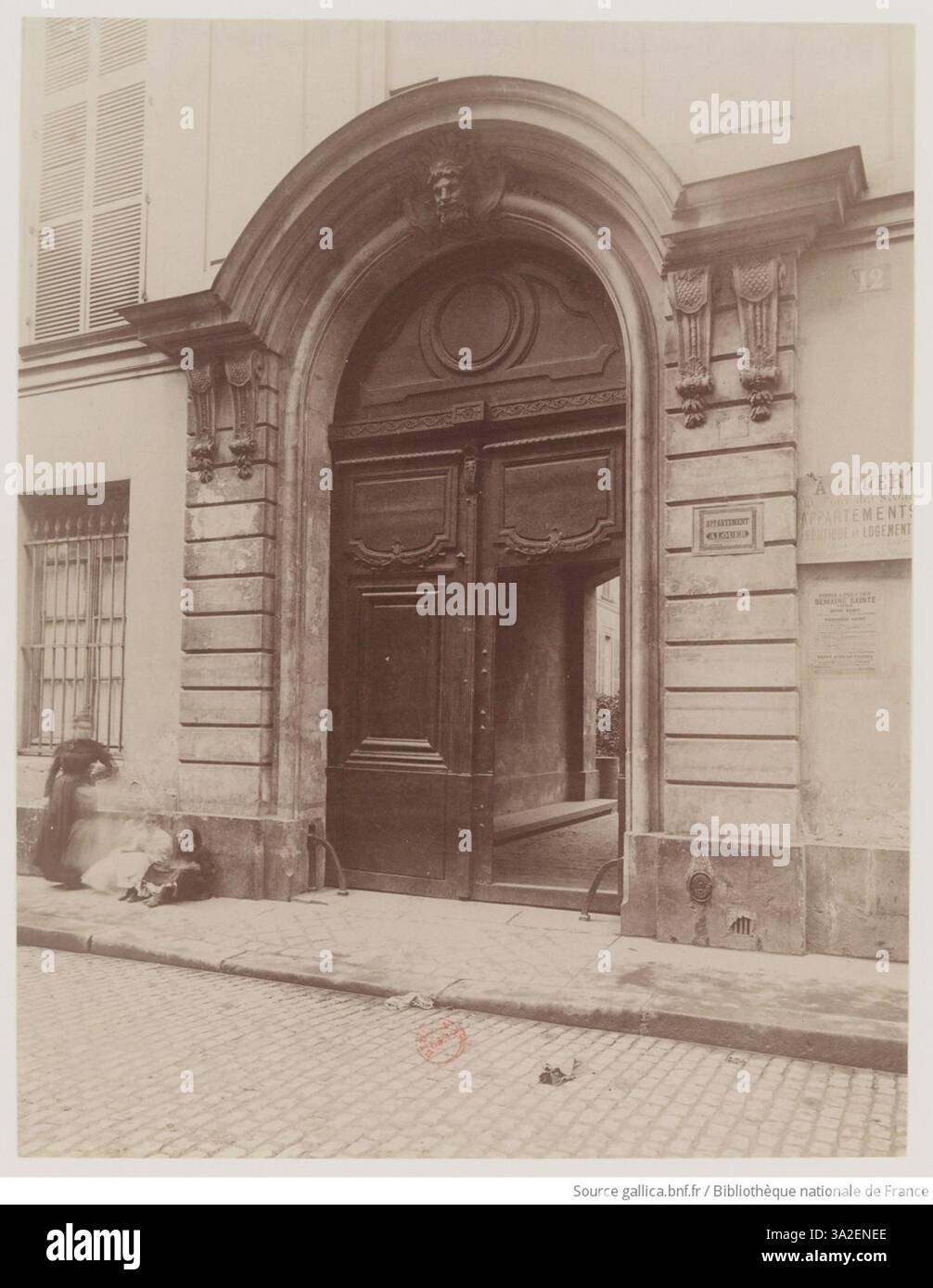 This photograph by Eugène Atget shows the Hôtel de la Brinvilliers ...