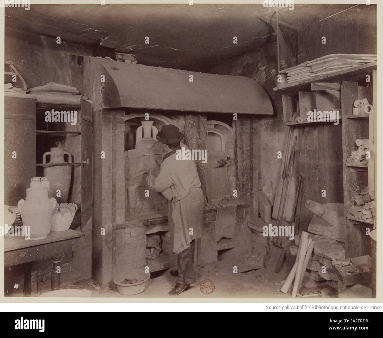 This photograph by Eugène Atget captures the interior of a ceramist's ...