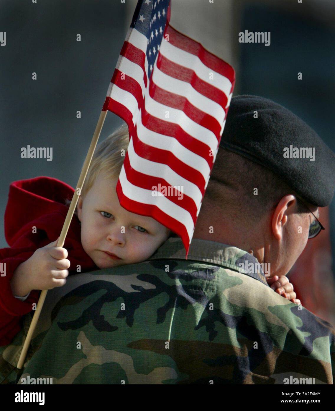 Jacob Mattison age 3, lays his head on his fathers Lt. Col. Curtis ...