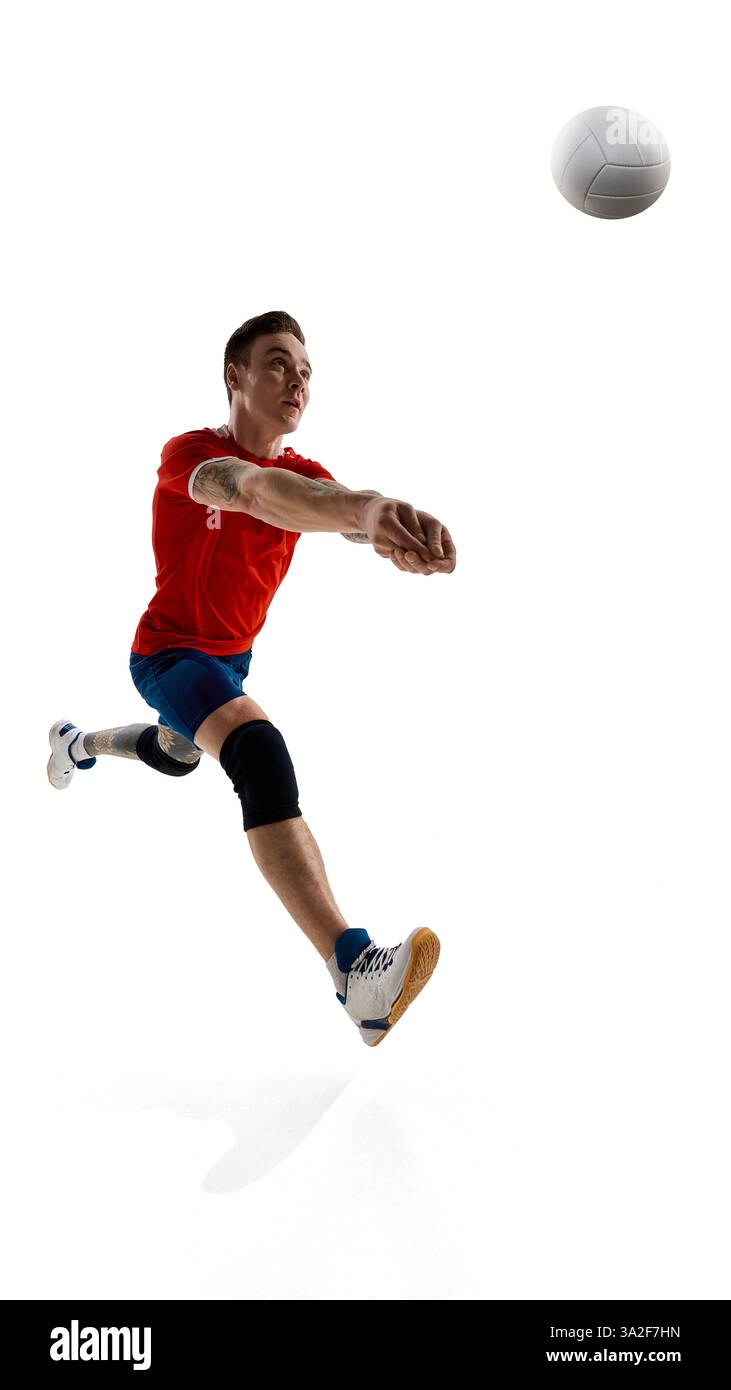 Full-length image of competitive young guy, volleyball player in ...