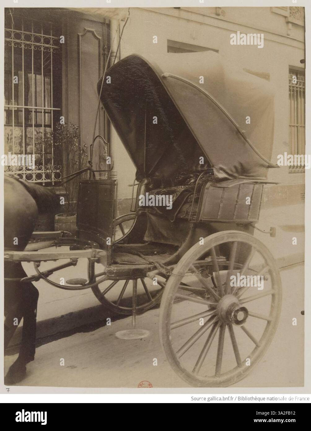 In this image from 1910, Eugène Atget captures a Cabriolet carriage, a ...