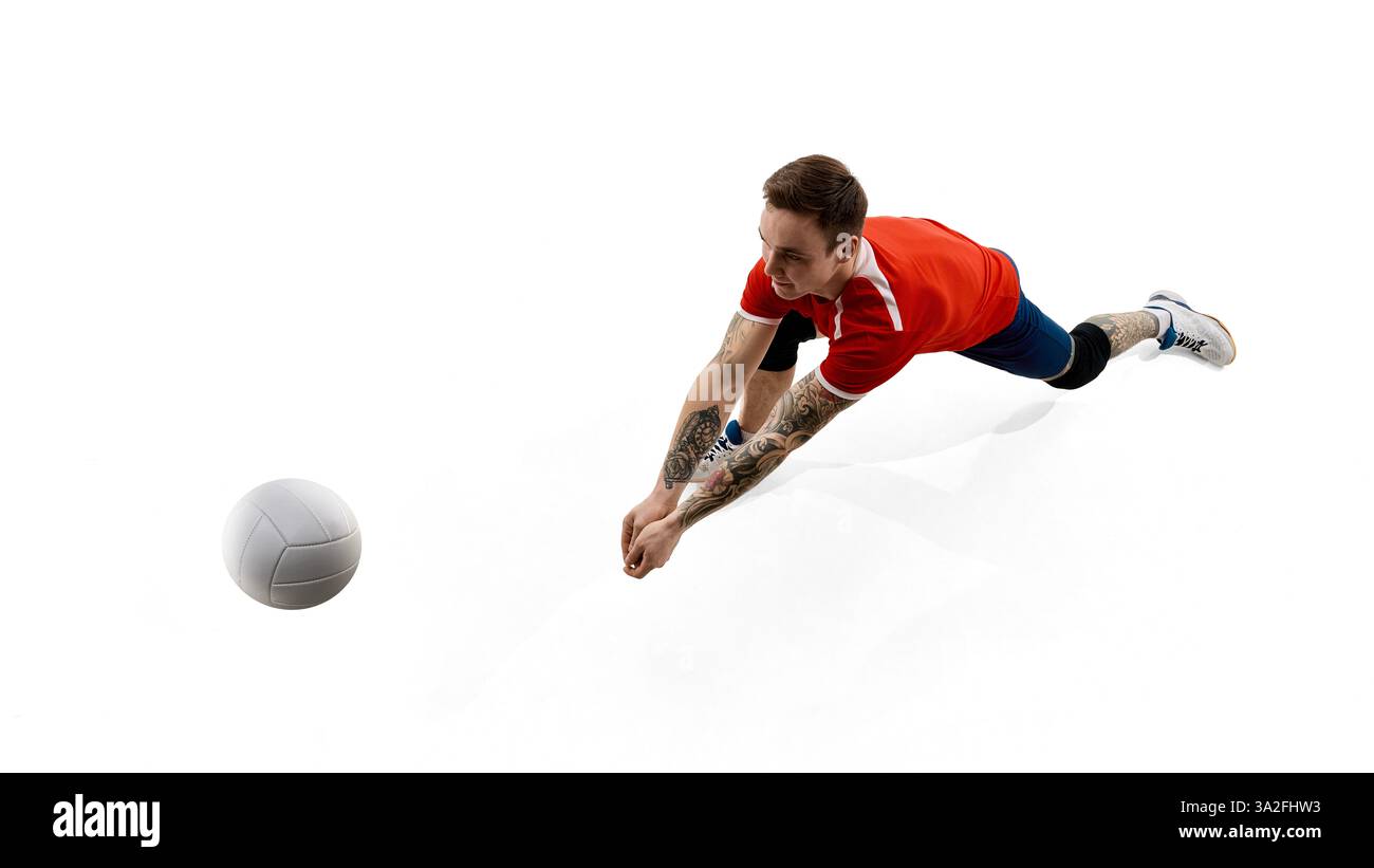 Top view image of concentrated male volleyball player reaching towards ...