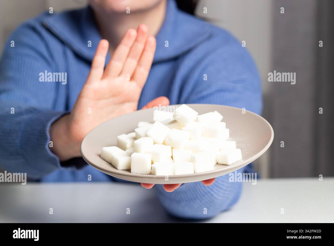 Woman decided to stop eat sugar for health and weight loss. Hand stop ...
