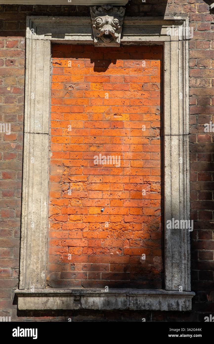 Close-up of a bricked-up window on the exterior of Trinity Green ...