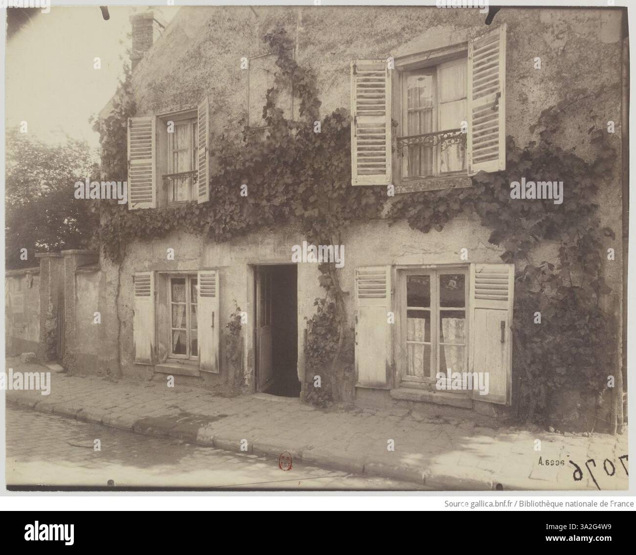 Atget's photograph captures an old house in Gif, showcasing its ...