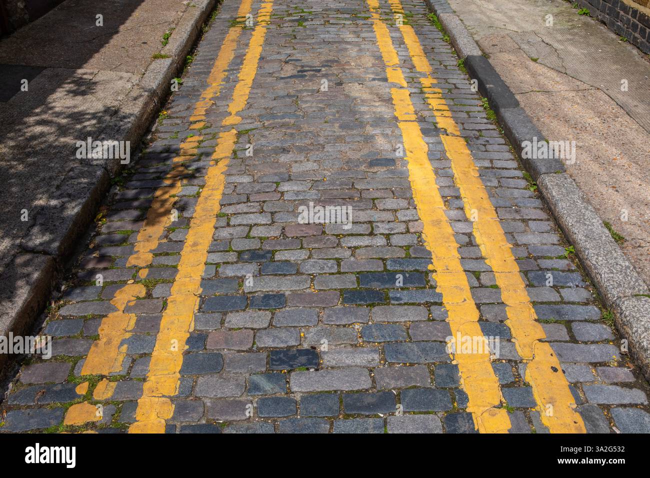 Double Yellow Lines on a narrow road in London, UK Stock Photo - Alamy
