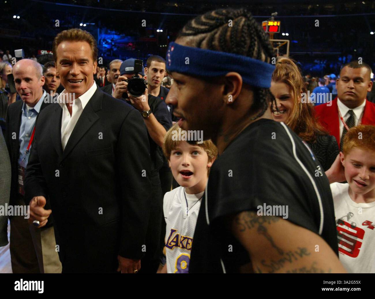 Just before the start of the game,Arnold with kids and wife meets Allen ...