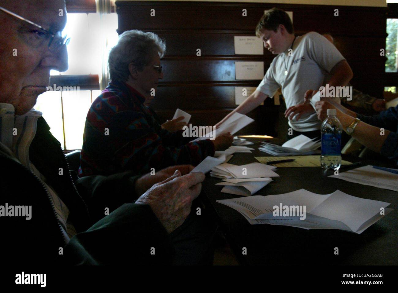 Lead: left foregroundJohn Reardon unfolds and gets the ballots ready ...