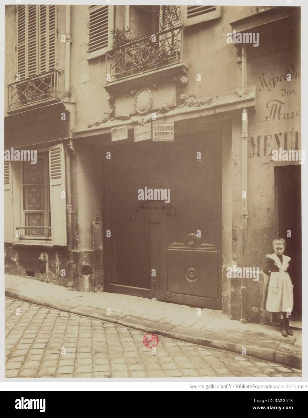 This 1910s photograph by Eugène Atget shows the door of an old house at ...