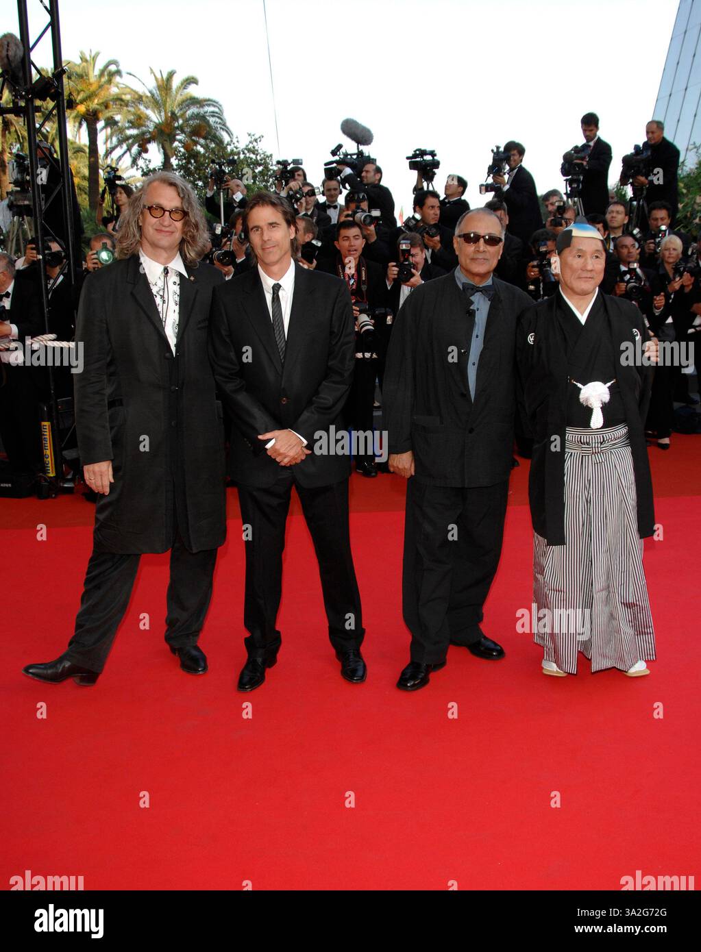 WIM WENDERS, WALTER SALLES, ABBAS KIAROSTAMI & TAKESHI KITANO.arriving at the Festival Palace ...