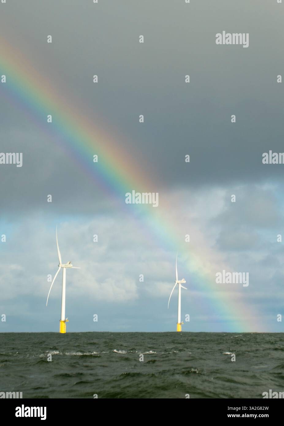 A rainbow over the Humber Gateway Offshore Windfarm, off the east coast ...