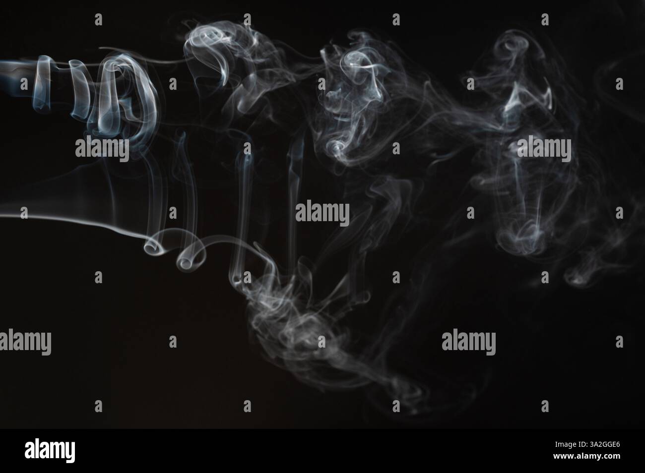 Smooth smoke swirl cloud on black background Stock Photo - Alamy