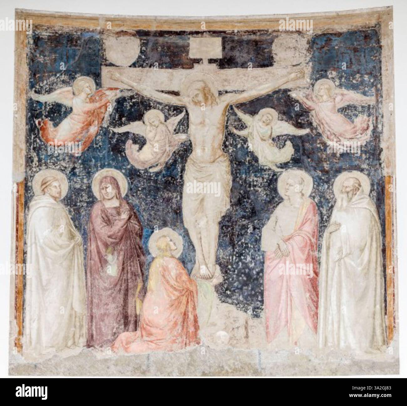 This mural painting by Taddeo Gaddi portrays the crucifixion of Christ, flanked by saints. The ...