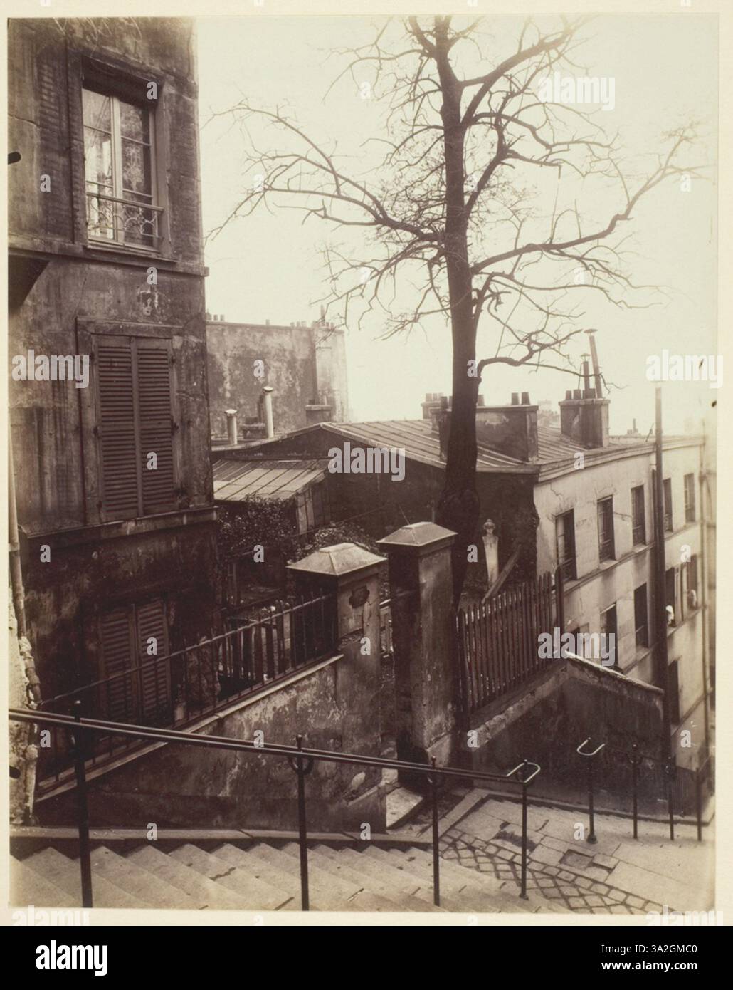 This photograph captures the street scene at 2 Rue de Calvaire in ...