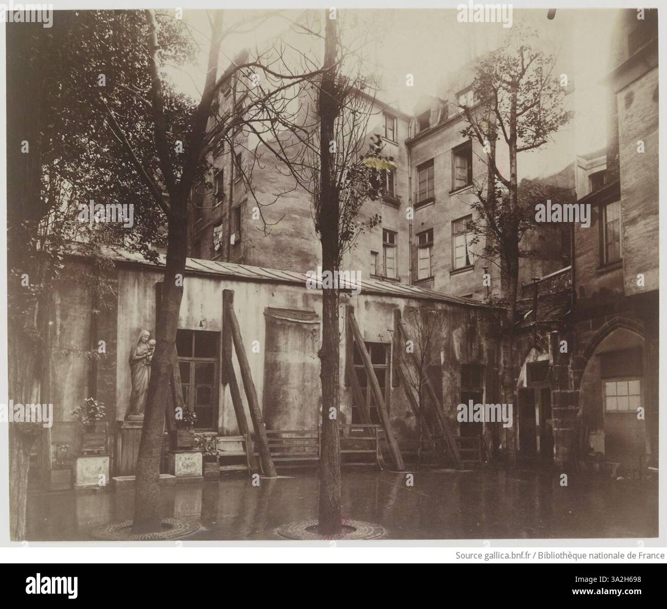 This photograph by Eugène Atget depicts a small building that once ...