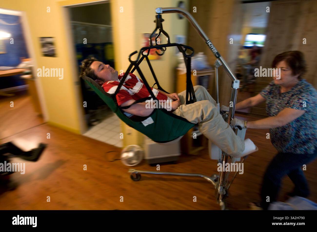 JUMP SECOND Heidi Miller transports her son from the bed to the ...