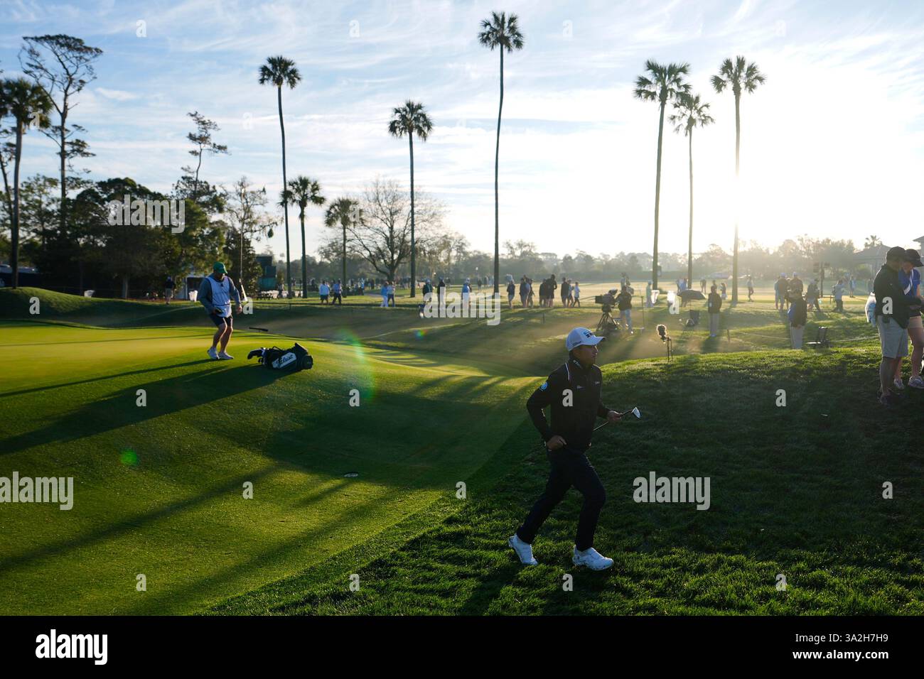 C.T. Pan walks off the second green during the first round of The ...