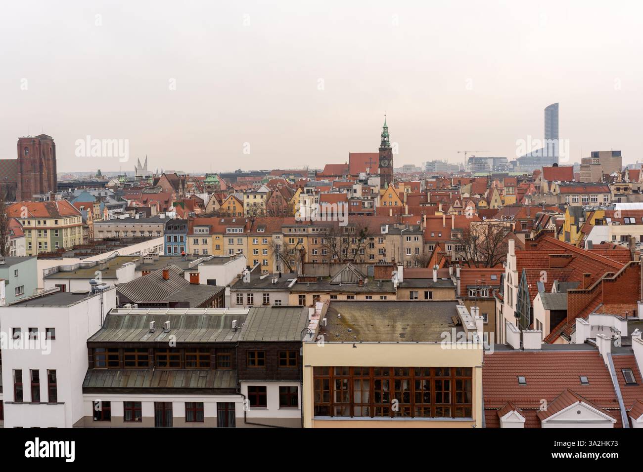 Scenic panoramic view of European city with historic red-roofed ...