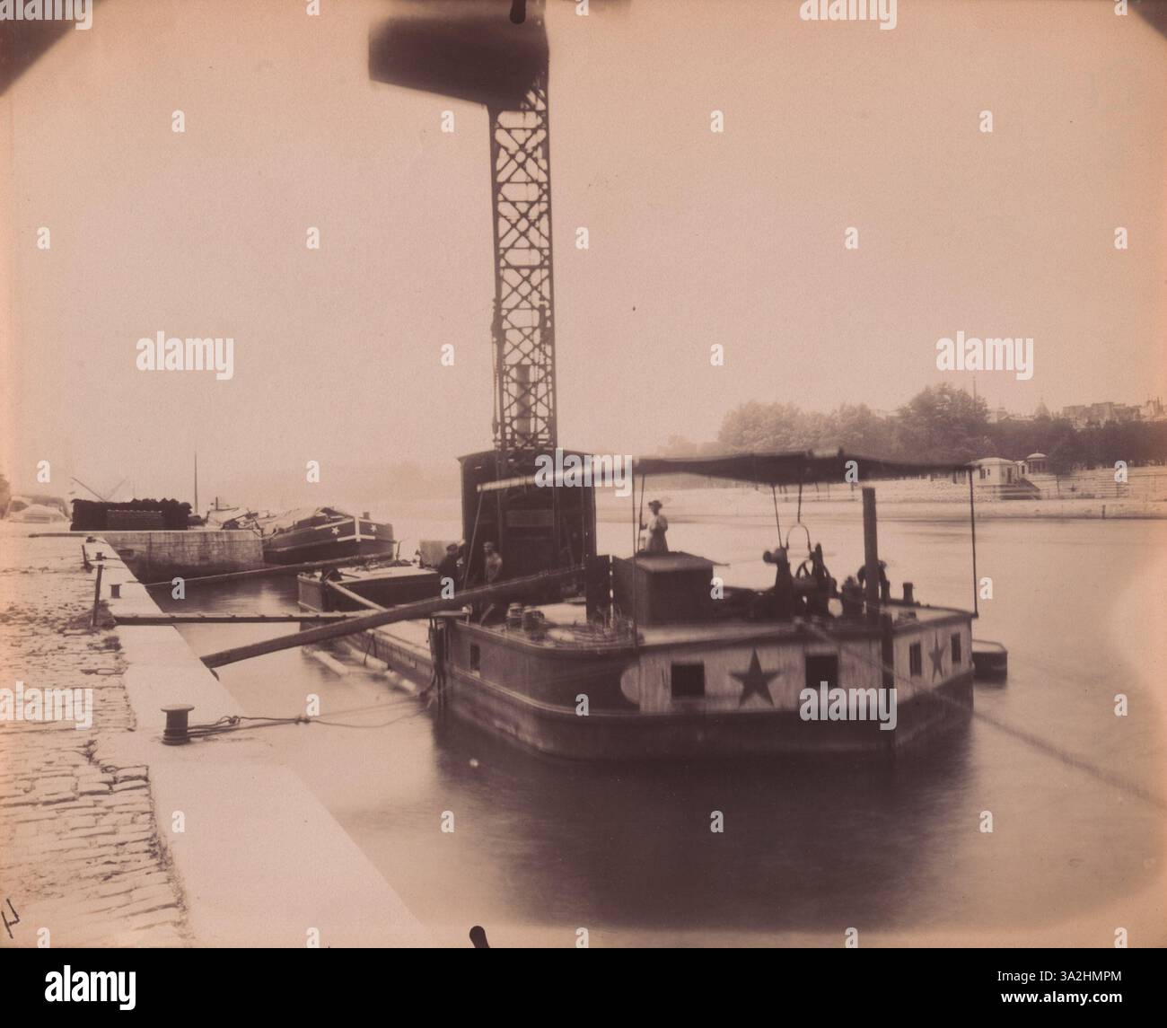 In this 1913 photograph, Eugène Atget captures the Port des Invalides ...