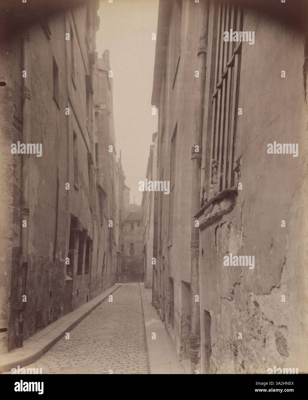 This 1899 photograph by Eugène Atget captures Rue de Nevers in Paris ...