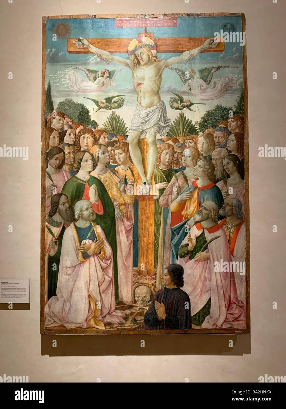 Benozzo Gozzoli’s 'Crucifixion with Saints' portrays the crucifixion of Christ surrounded by key ...
