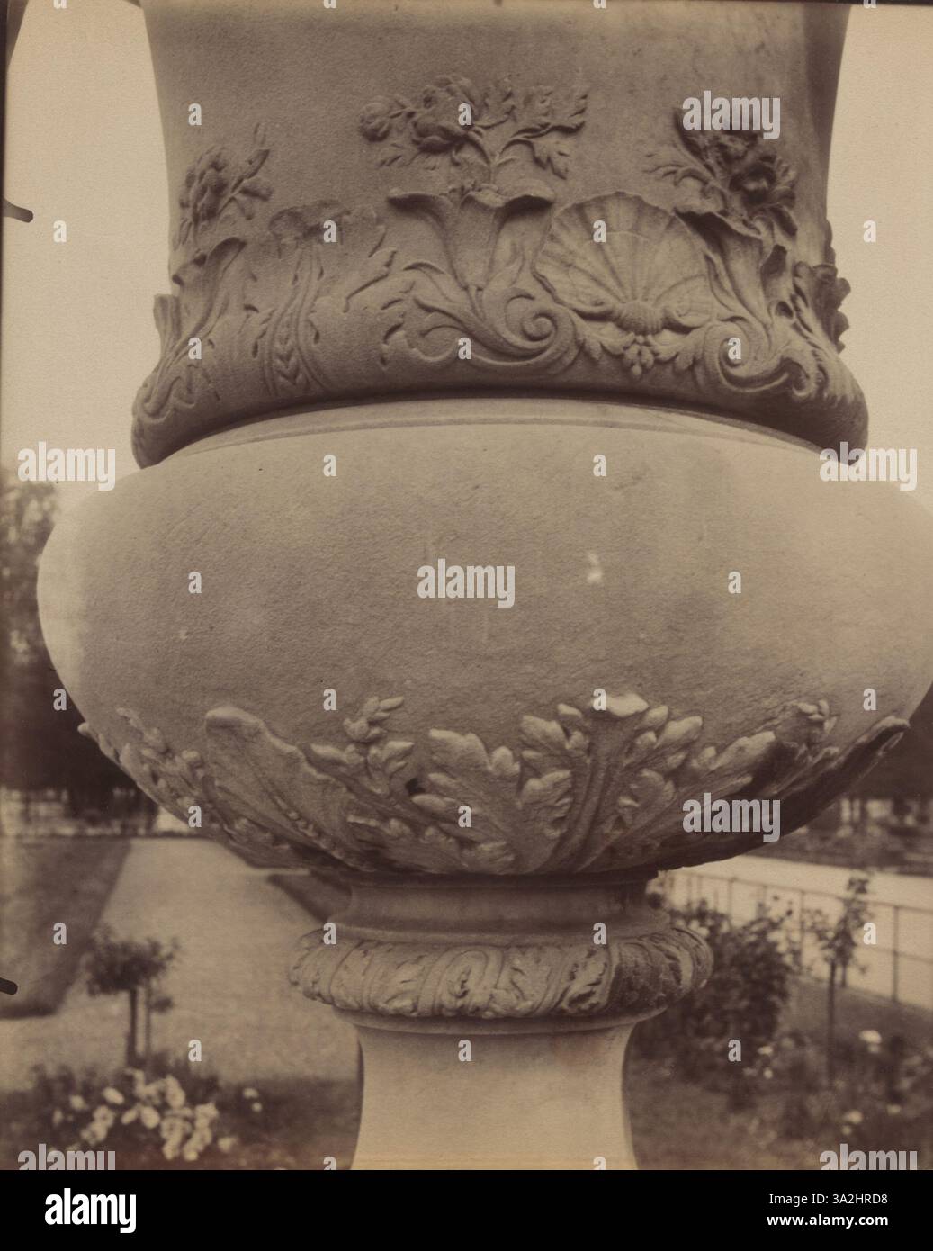 This 1912 image features a decorative vase in the Tuileries Gardens ...