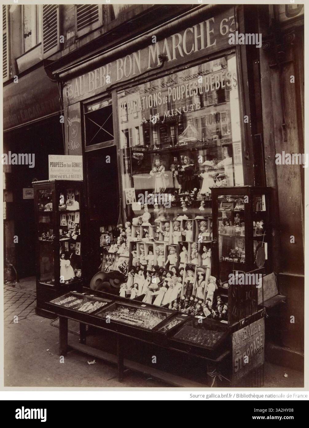 This photograph by Eugène Atget shows a boutique at 63 Rue de Sèvres ...