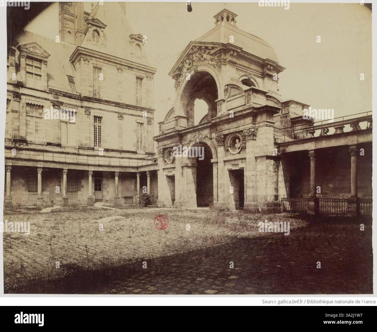 In this photograph, Eugène Atget documents the Cour Ovale and ...