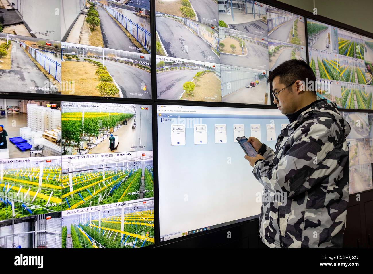 TAIZHOU, CHINA - MARCH 13, 2025 - A technician controls temperature ...