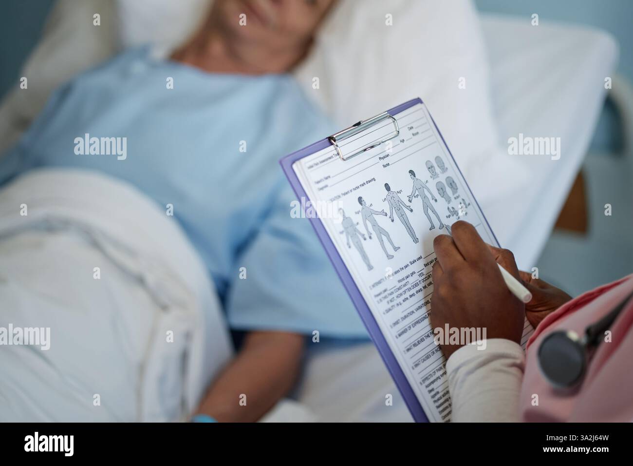 Medical professional checking patient's health chart while patient ...