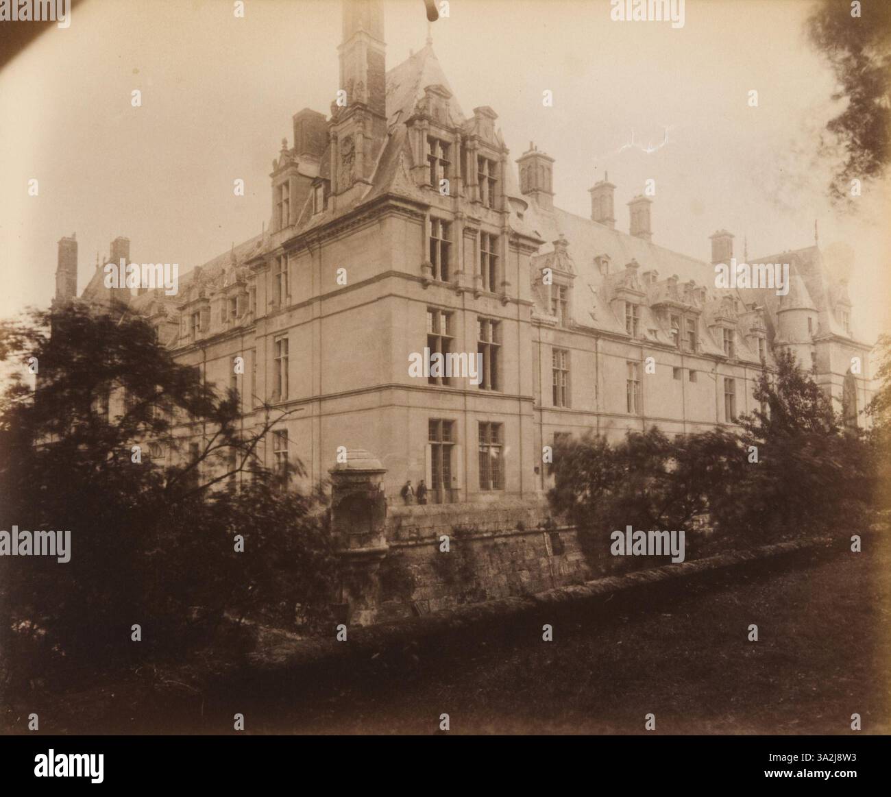 Atget’s photograph shows the Château d'Ecouen, a Renaissance-era castle ...