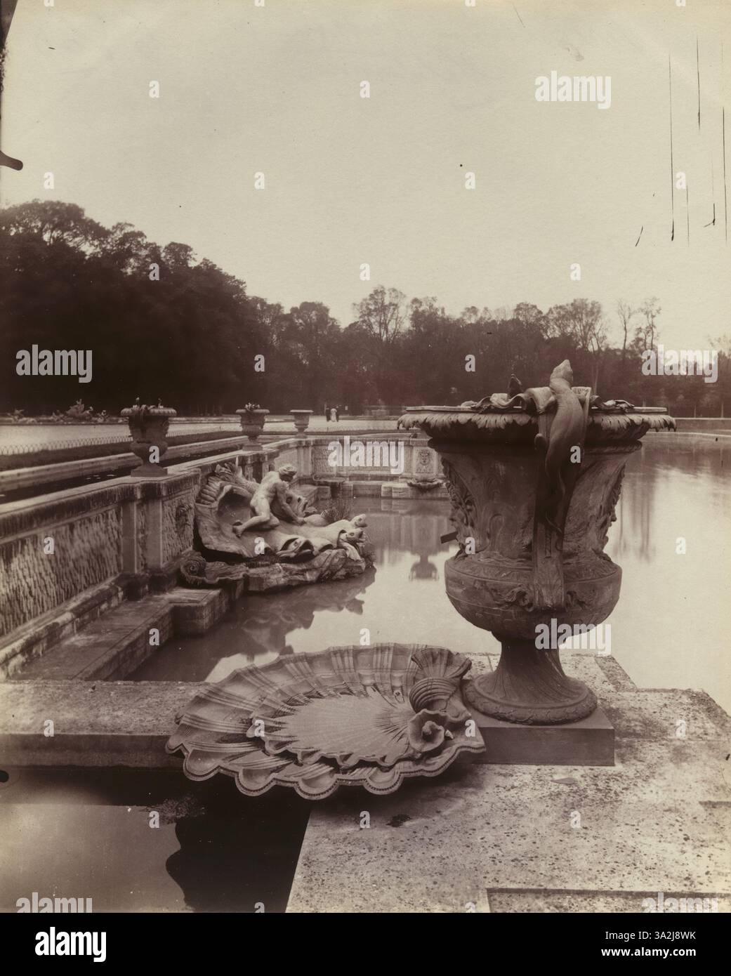 This 1902 photograph by Eugène Atget features the Bassin de Neptune at ...