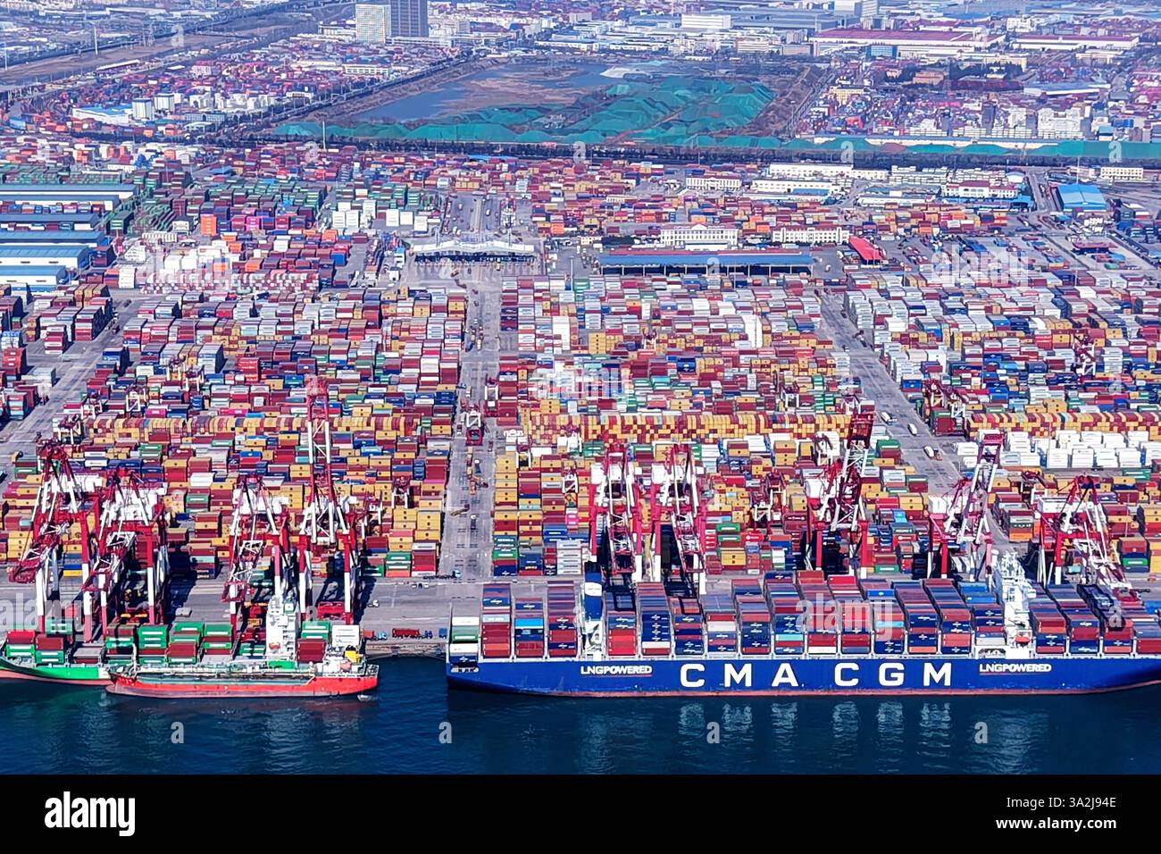 Cargo ships load and unload containers for foreign trade at Qingdao ...