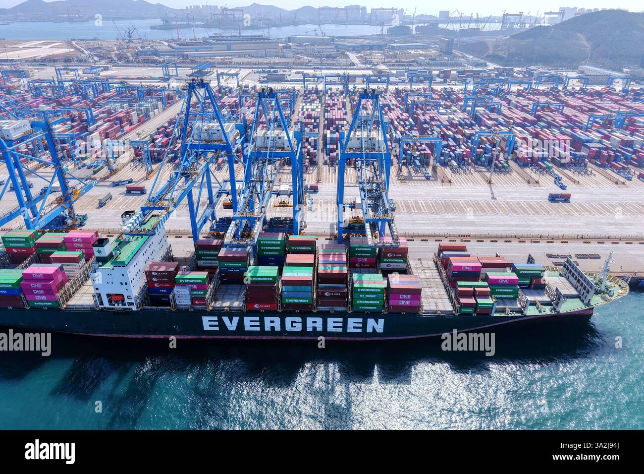 Cargo ships load and unload containers for foreign trade at Qingdao ...