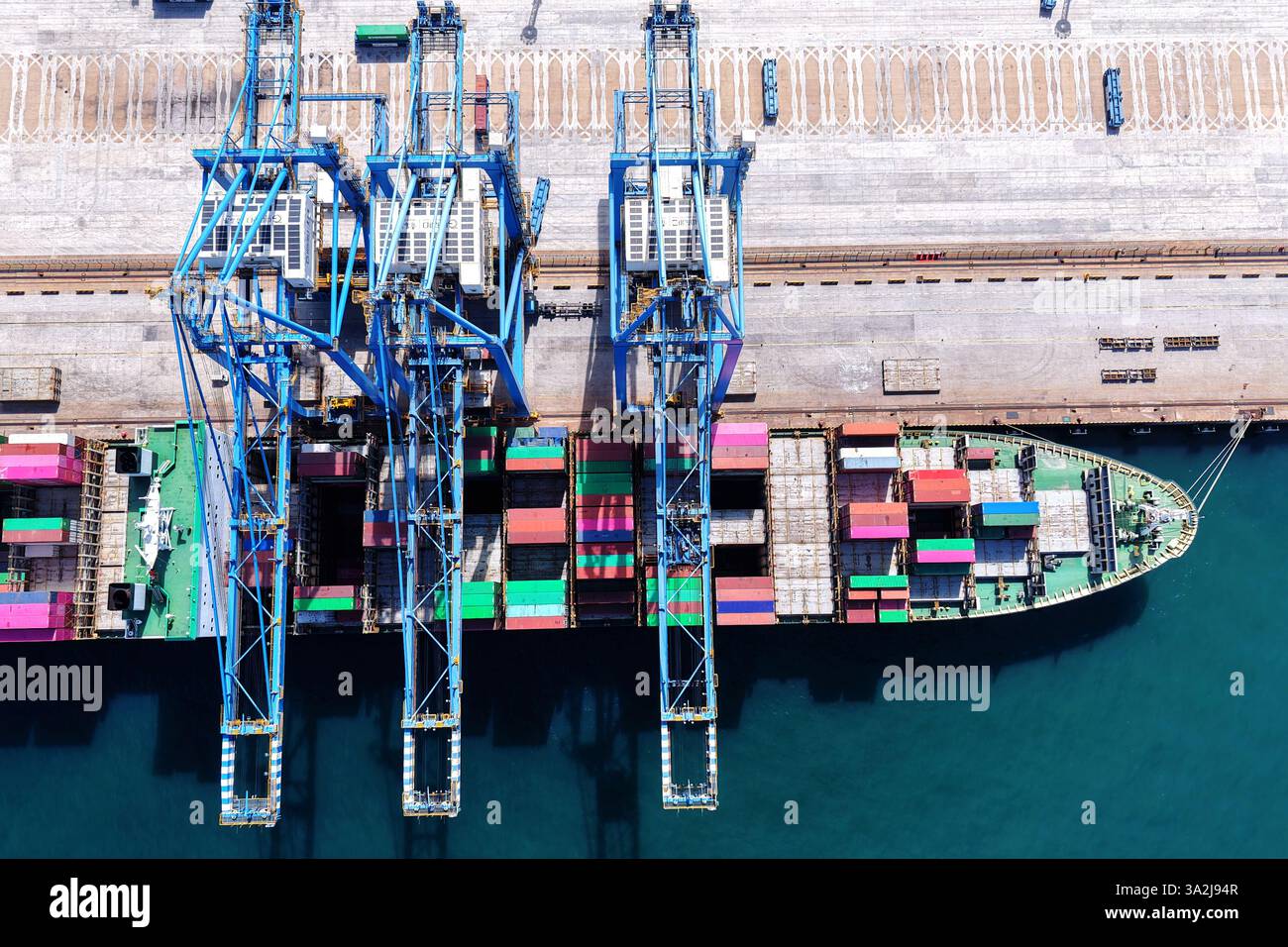 Cargo ships load and unload containers for foreign trade at Qingdao ...