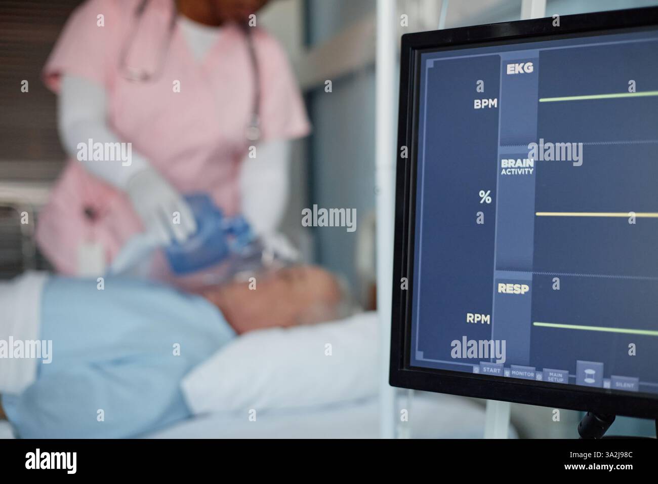 Healthcare professional monitoring elderly patient's vital signs using ...