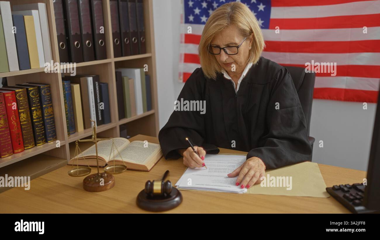 Woman judge writing documents in an american courtroom with books ...