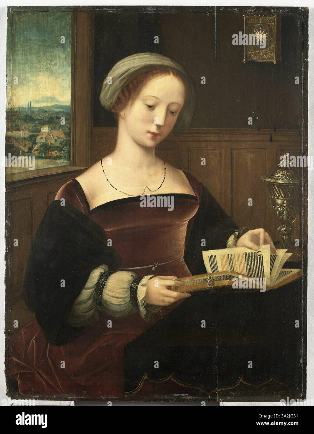 This painting portrays Saint Mary Magdalene reading, symbolizing ...