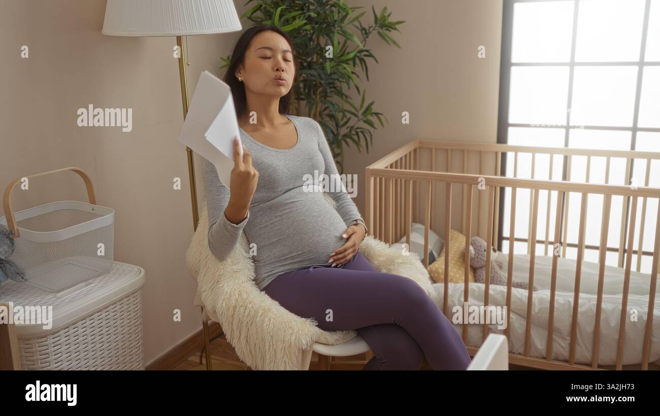 Pregnant woman fanning herself hi-res stock photography and images - Alamy