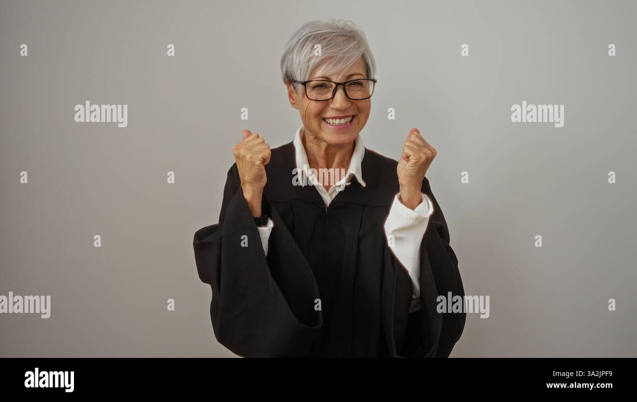 Woman happily celebrating success with raised fists wearing judge's ...