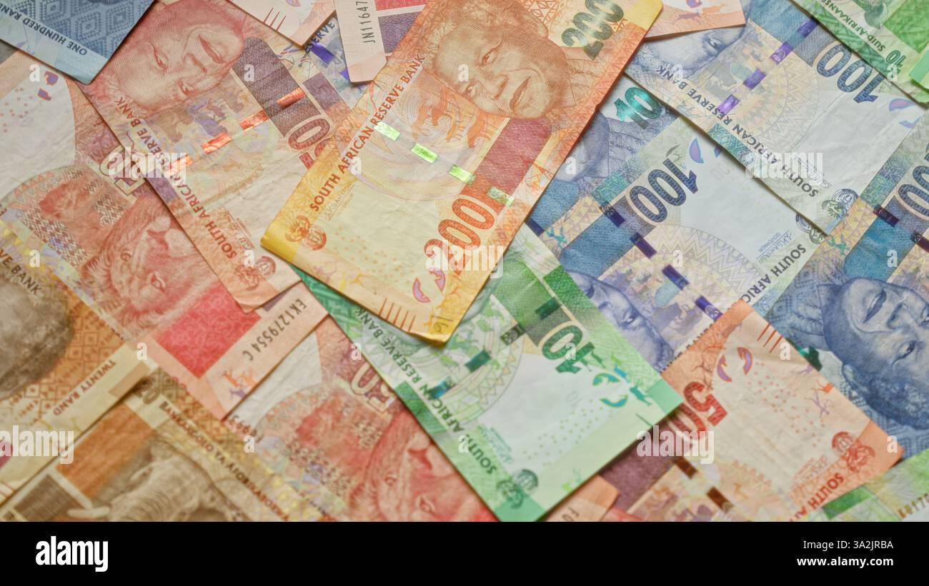 Various south african rand banknotes featuring mandela laid out in a ...