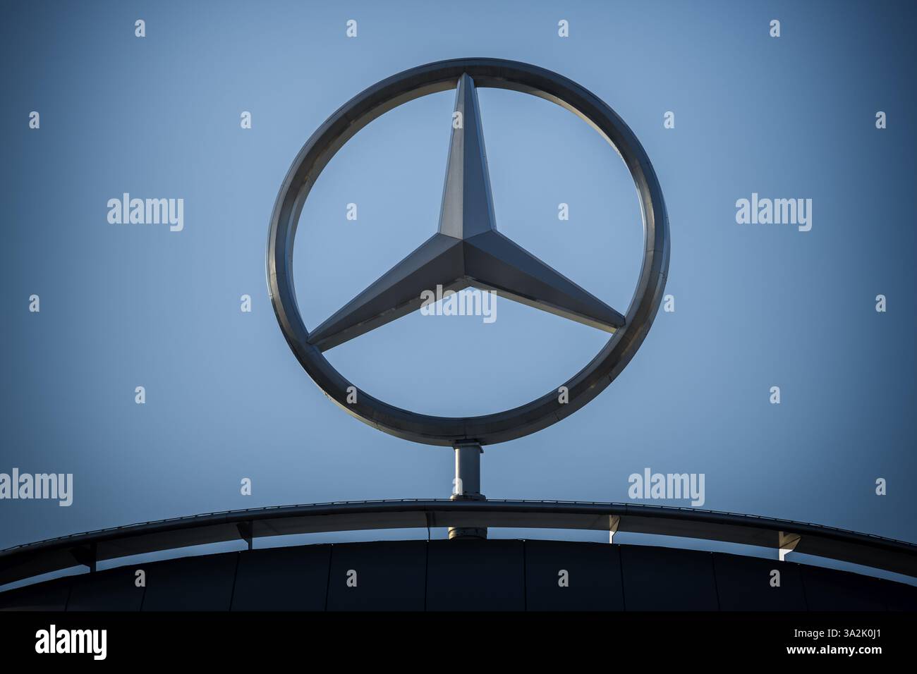 Close-up of the Mercedes logo under a blue sky, Mercedes star ...