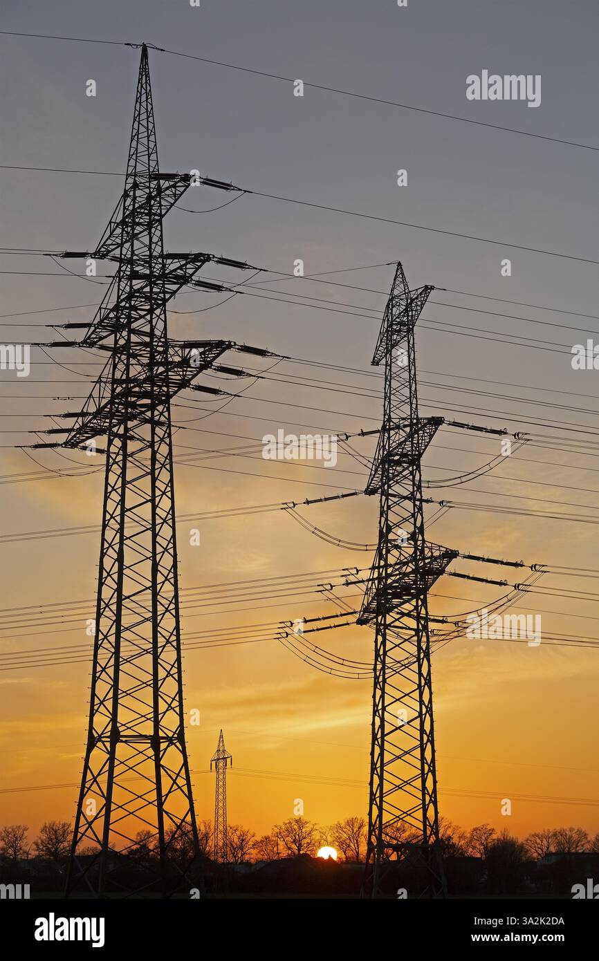 Sunset behind high-voltage pylons, Haecklingen, Lueneburg, Lower Saxony ...