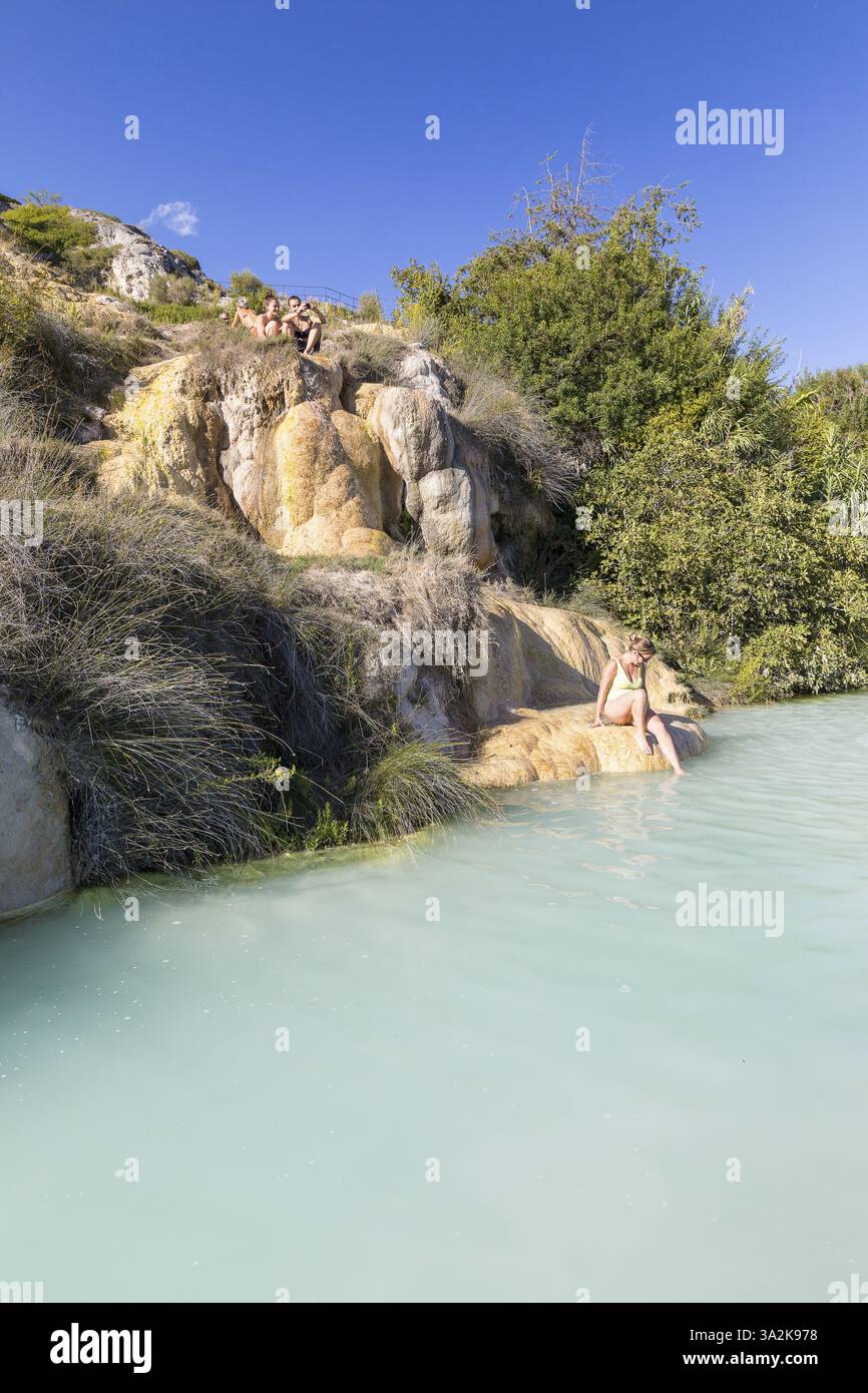 Bathers in one of the thermal pools between the cascades in the ...